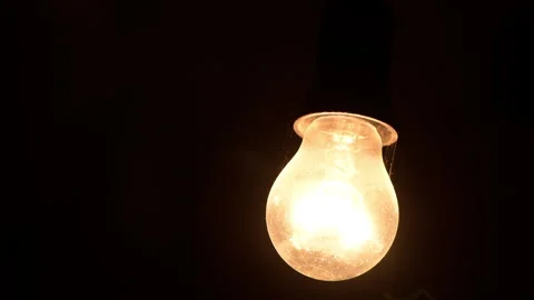 Incandescent light bulb in dark, spooky ... | Stock Video | Pond5