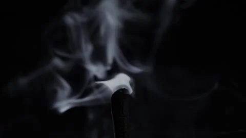 Incense stick smoke spreading in black b... | Stock Video | Pond5