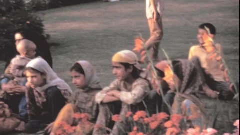 India - 1973: woman sit in park wear bur... | Stock Video | Pond5