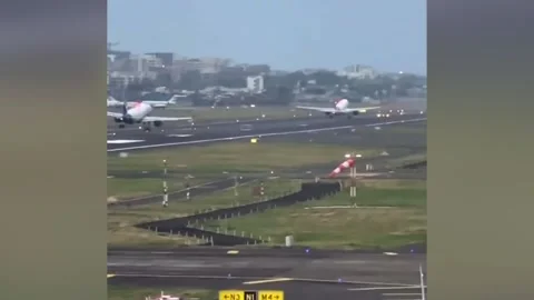 India: IndiGo plane lands just feet behi... | Stock Video | Pond5