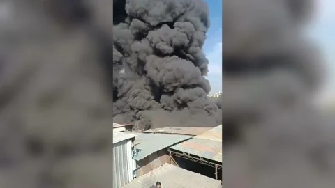India: Scrap yard fire sends flames alon... | Stock Video | Pond5