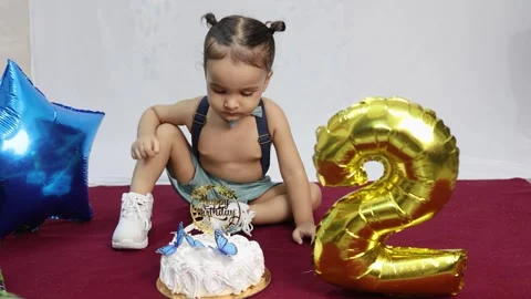 Indian Baby Boy eating cake at Birthday ... | Stock Video | Pond5