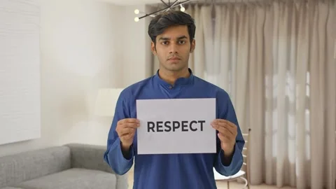 Indian boy holding RESPECT banner | Stock Video | Pond5