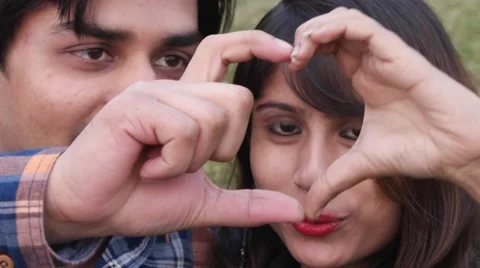 indian couple making a heart shape towar... | Stock Video | Pond5