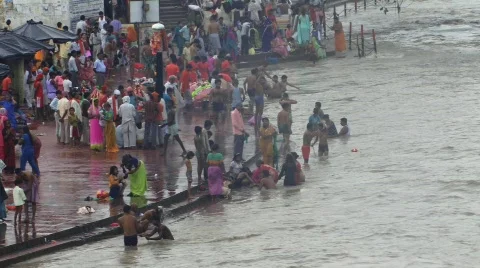 Indian crowd bathe in Ganges (w/sound) 3 | Stock Video | Pond5
