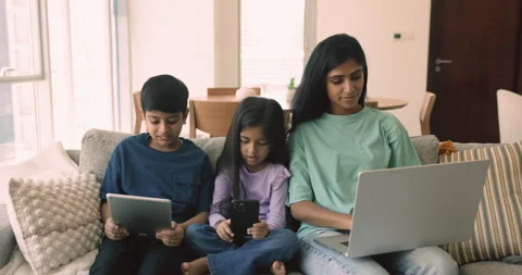 Indian family using diverse electronic d... | Stock Video | Pond5