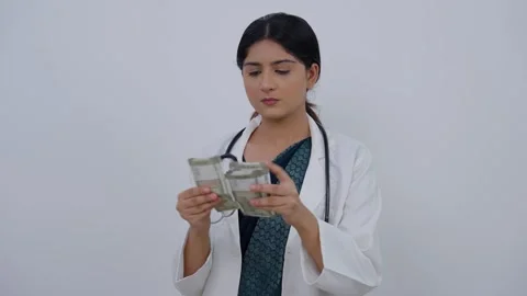Indian Female Doctor Counting Money, Ind... | Stock Video | Pond5