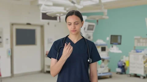 Indian female doctor inspecting surgical... | Stock Video | Pond5