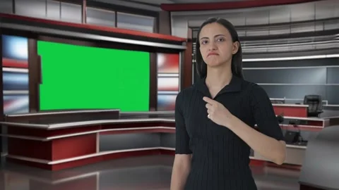 Indian female news anchor pointing at gr... | Stock Video | Pond5