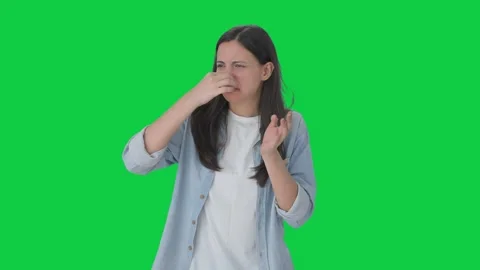 Indian girl disturbed by bad smell Green... | Stock Video | Pond5