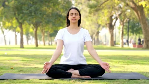 Indian girl doing breathing exercise | Stock Video | Pond5