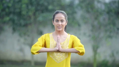 Indian girl doing Namaskar yoga pose | Stock Video | Pond5