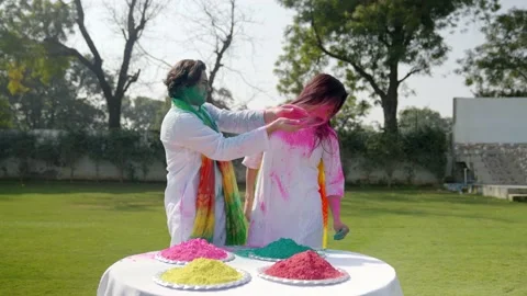 Indian girl putting colors on her husban... | Stock Video | Pond5