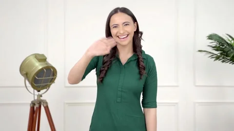 Indian girl saying Hi and waving hand | Stock Video | Pond5