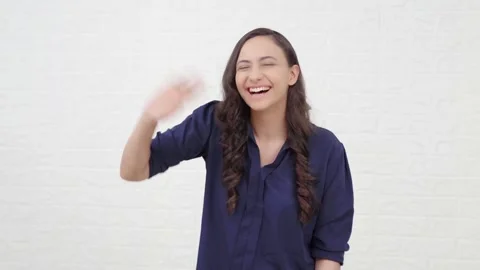 Indian girl waving Hi and saying hello | Stock Video | Pond5