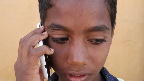 Indian kids talking on mobile cell phone | Stock Video | Pond5