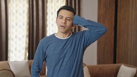 Indian man doing neck stretch exercise | Stock Video | Pond5