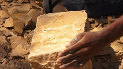 An Indian man hammering a stone block | Stock Video | Pond5