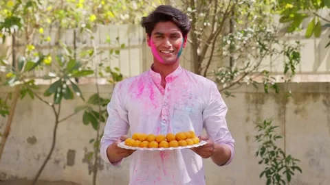 Indian Man Holding Sweets Thali with Hol... | Stock Video | Pond5