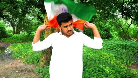 Indian man holding tricolor flag with tr... | Stock Video | Pond5