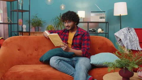 Indian man reading interesting book turn... | Stock Video | Pond5