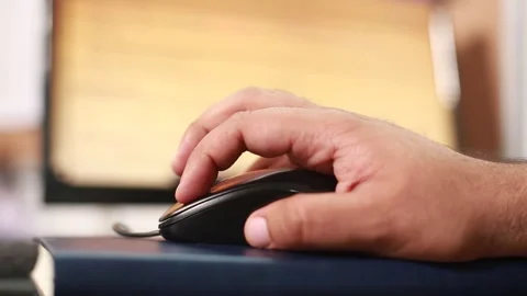 An Indian man scrolling his computer mou... | Stock Video | Pond5