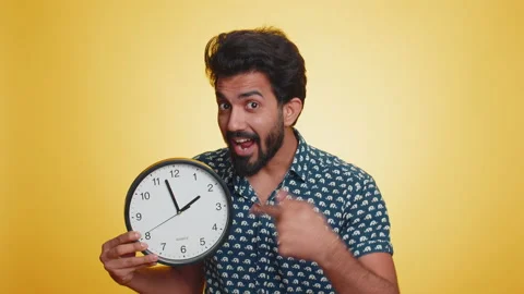 Indian man showing time on wall office c... | Stock Video | Pond5