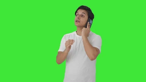 Indian man talking on call Green screen | Stock Video | Pond5