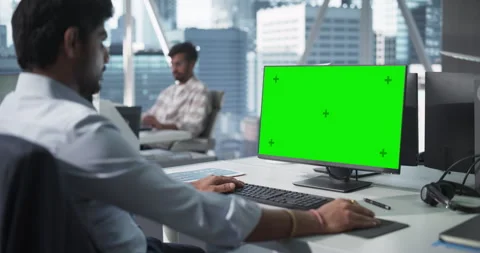 Indian Man Working on Computer with Gree... | Stock Video | Pond5