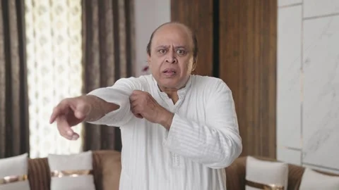 Indian old man asking questions and dive... | Stock Video | Pond5