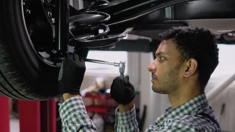 Indian or pakistani auto mechanic workin... | Stock Video | Pond5