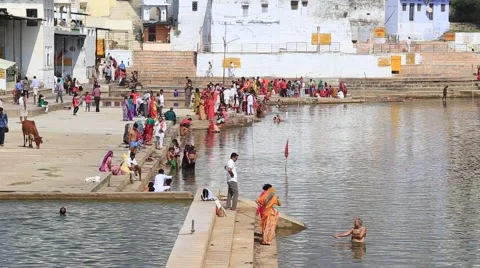 Indian people ritual washing in sacred l... | Stock Video | Pond5