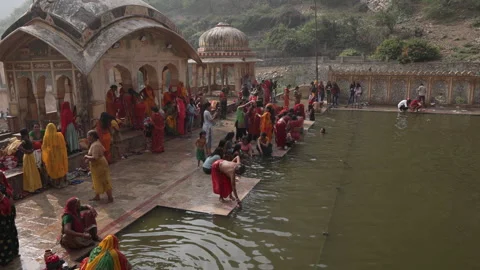 Indian pilgrims having a bath in Galtaji... | Stock Video | Pond5