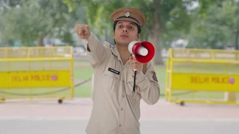 Indian police officer controlling crows ... | Stock Video | Pond5