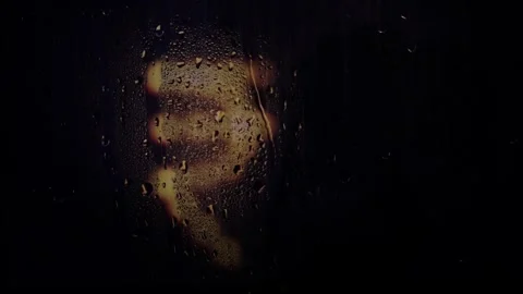 Indian Rupee sign behind rain wet window | Stock Video | Pond5