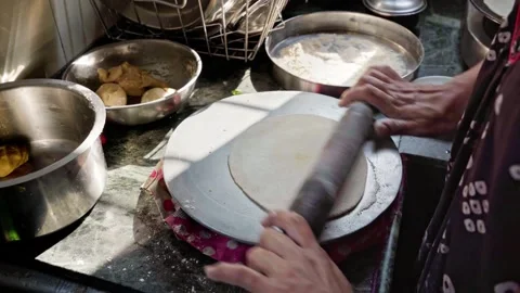 indian woman making roti, chapati or pur... | Stock Video | Pond5