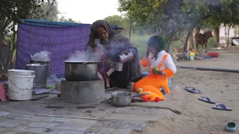 Indian woman making tea for her family i... | Stock Video | Pond5