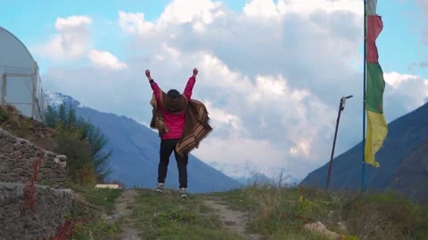Indian woman raising her arms in front o... | Stock Video | Pond5
