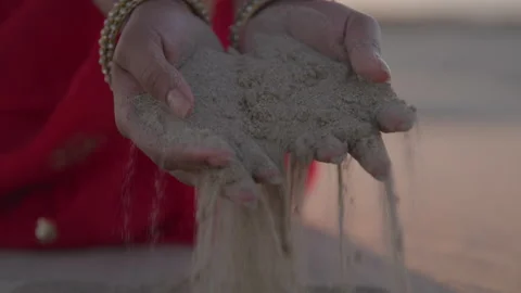 Indian Woman Scooping Sand At Golden Hou... | Stock Video | Pond5