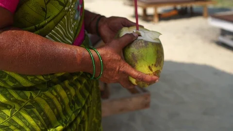 Indian woman seller giving coconut to yo... | Stock Video | Pond5