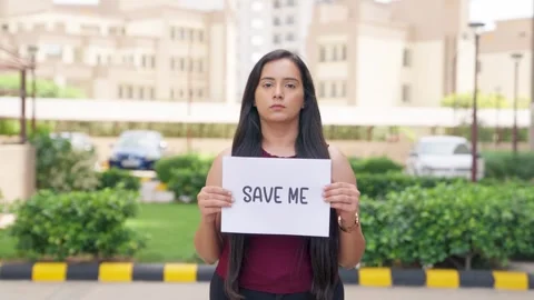Indian Woman standing with Save Me Poste... | Stock Video | Pond5