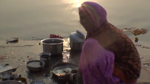 Indian women washing the dishes in water... | Stock Video | Pond5