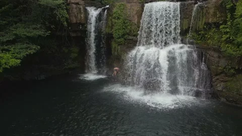 Indigenous man climbing jungle waterfall... | Stock Video | Pond5