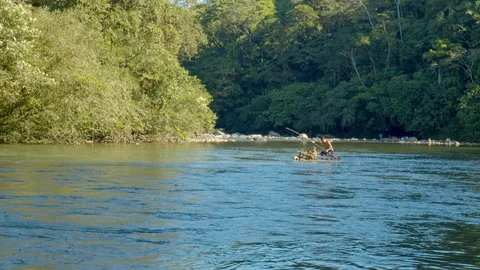 indigenous man rowing against the curren... | Stock Video | Pond5