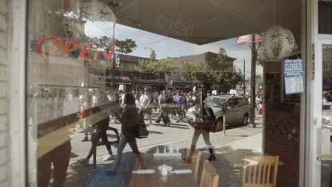 Indigenous parade reflection in windows | Stock Video | Pond5