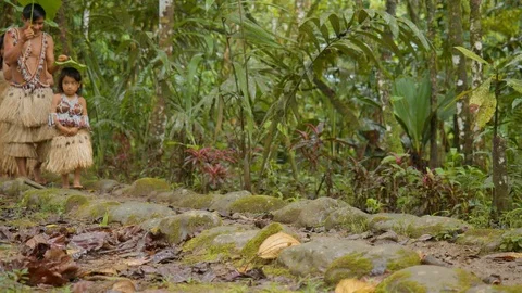indigenous people walking thru a path wi... | Stock Video | Pond5