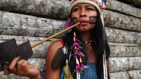 Indigenous Woman Smoking Pipes in a Tupi... | Stock Video | Pond5