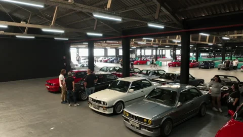 Indoor car meet featuring BMW e30, many ... | Stock Video | Pond5