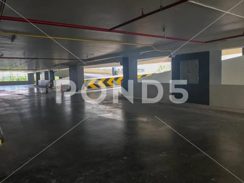 Indoor empty car parking lot and ramp building Stock Photo #127810050