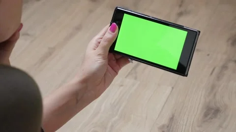 Indoor woman holding green screen displa... | Stock Video | Pond5